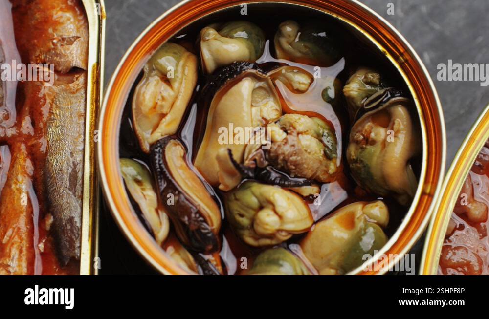 Spanish fish seafood Canned preserves food in tin open cans. sardines ...