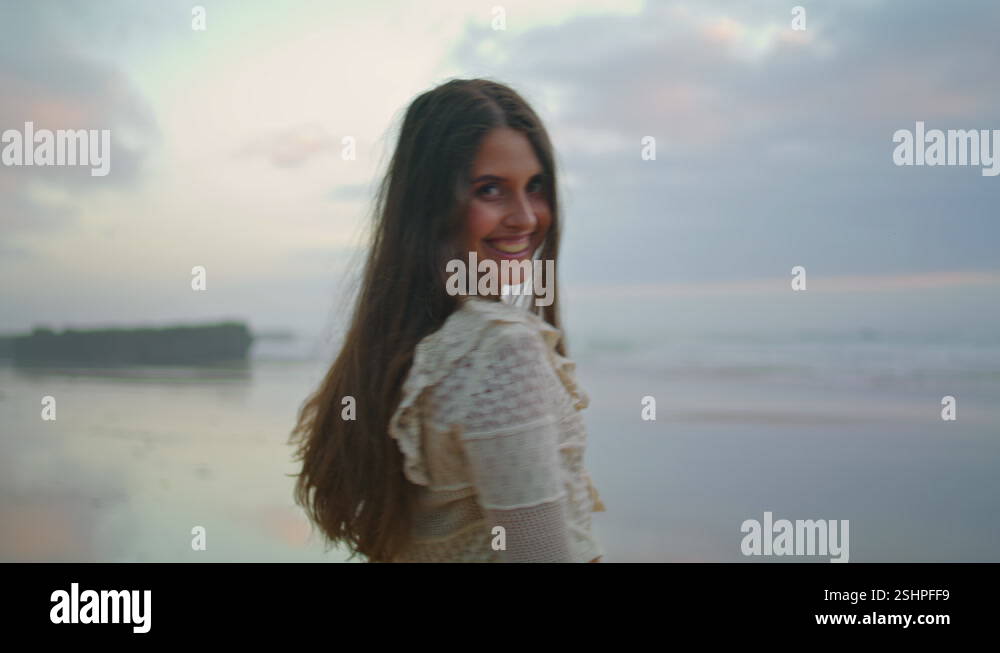 Playful girl posing water view place portrait. Laughing lady looking ...