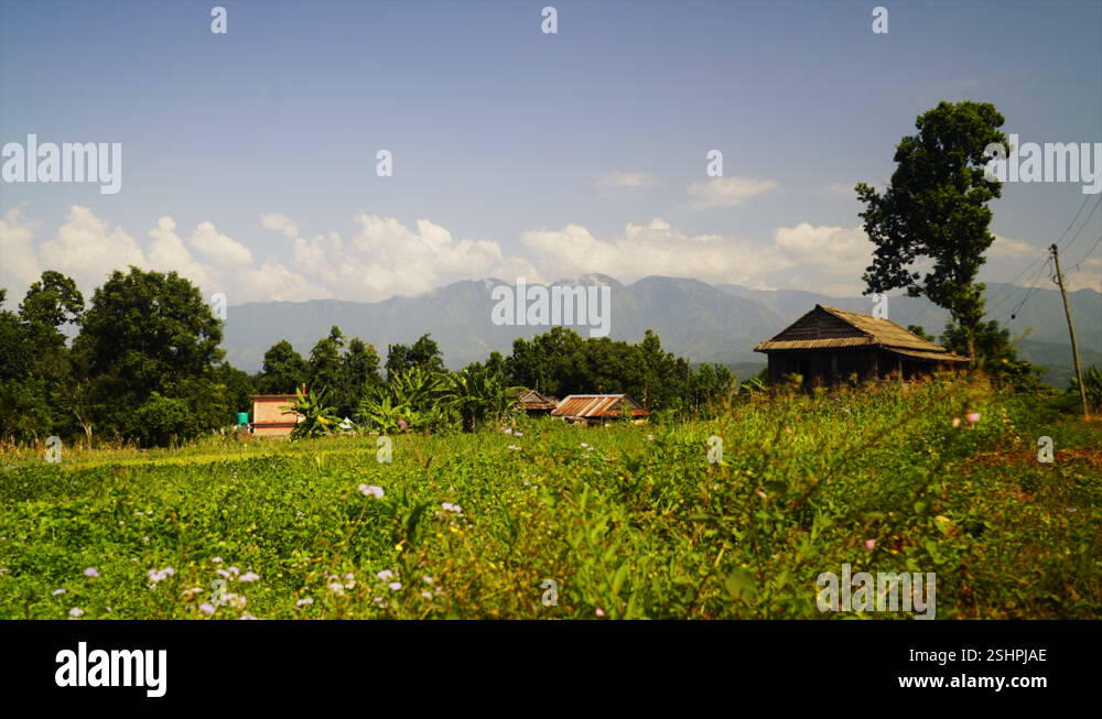 Timelapse of shadow of clouds moving over a green field in Nepal Stock ...
