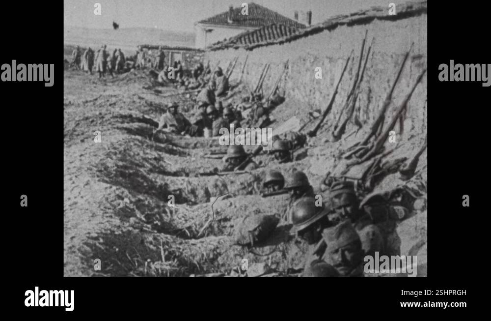 1910s: Men in trench on battlefield. Soldiers on road. Title card ...