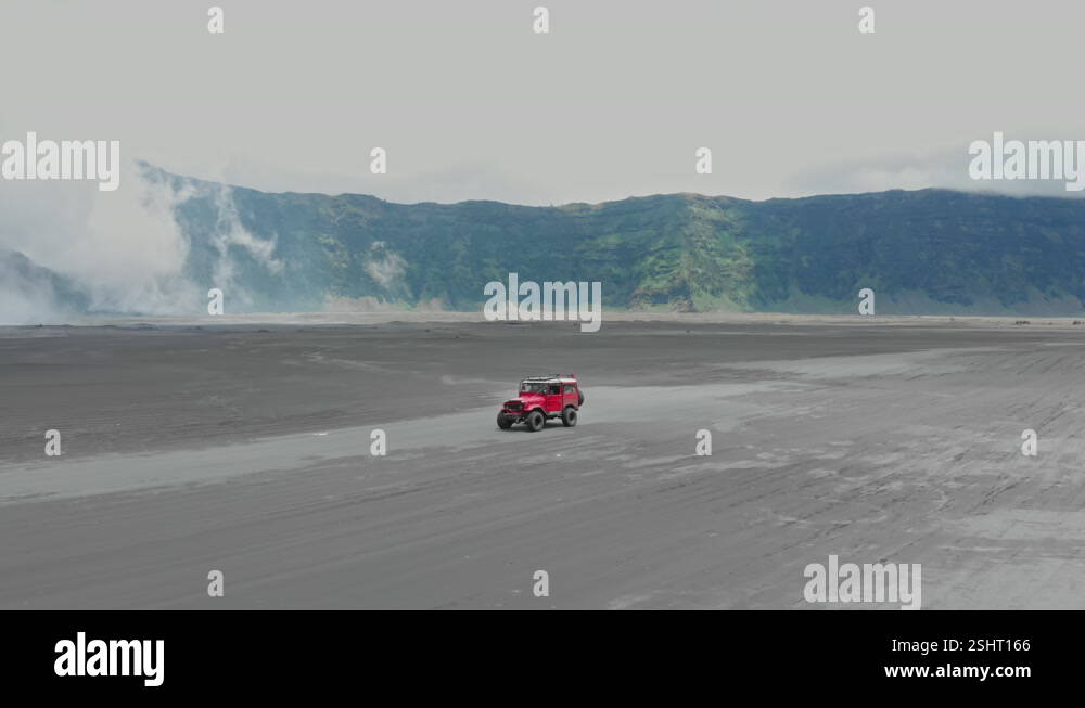Car drive to Mount Bromo Crater active volcano with smoke in Jawa ...