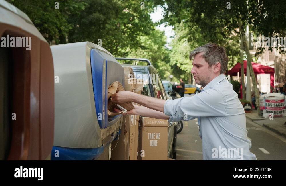 Man hand throwing empty paper garbage, recycling of carton delivery ...