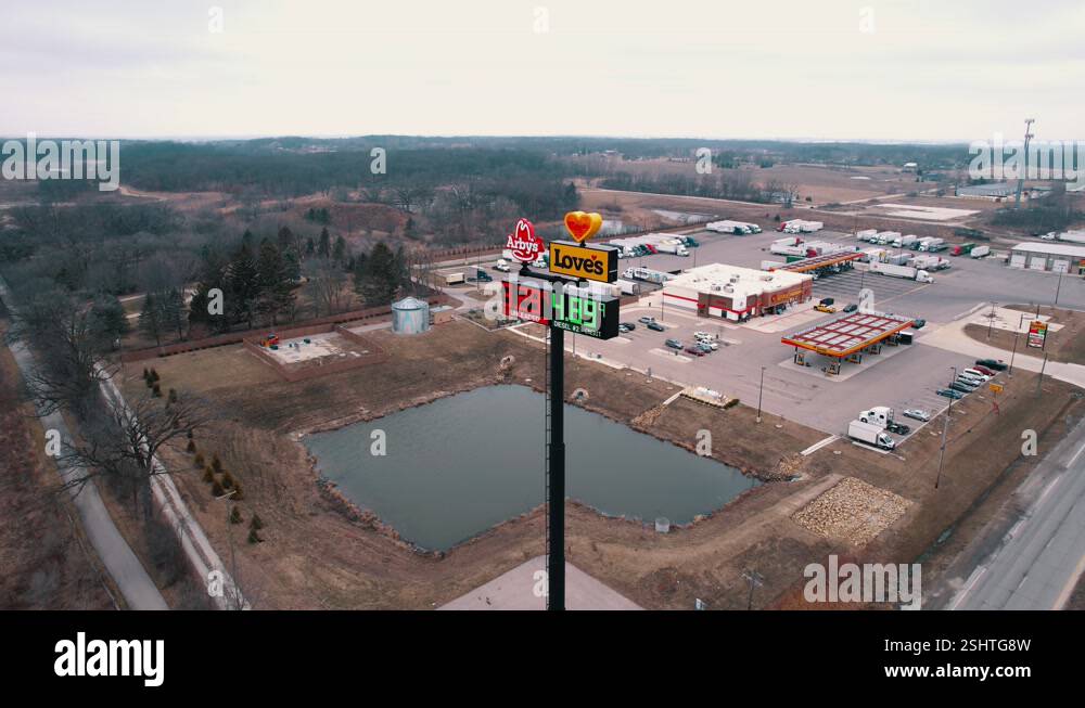 orbiting around Loves truck stop sign with Arbys fast food restaurant ...