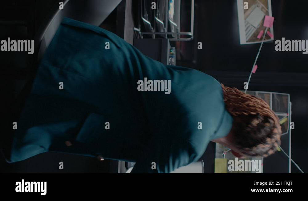 Vertical video: Police investigator examining clues from crime scene ...