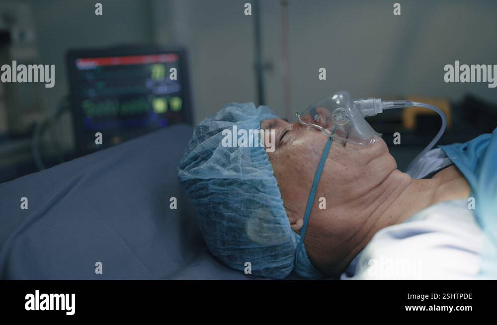 Patient face while wear medical ventilator lying on bed in the ...