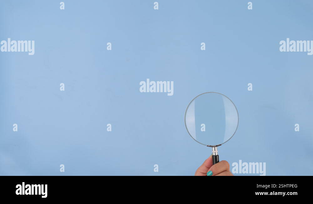 Female hands holding magnifying glass Stock Videos & Footage - HD and ...