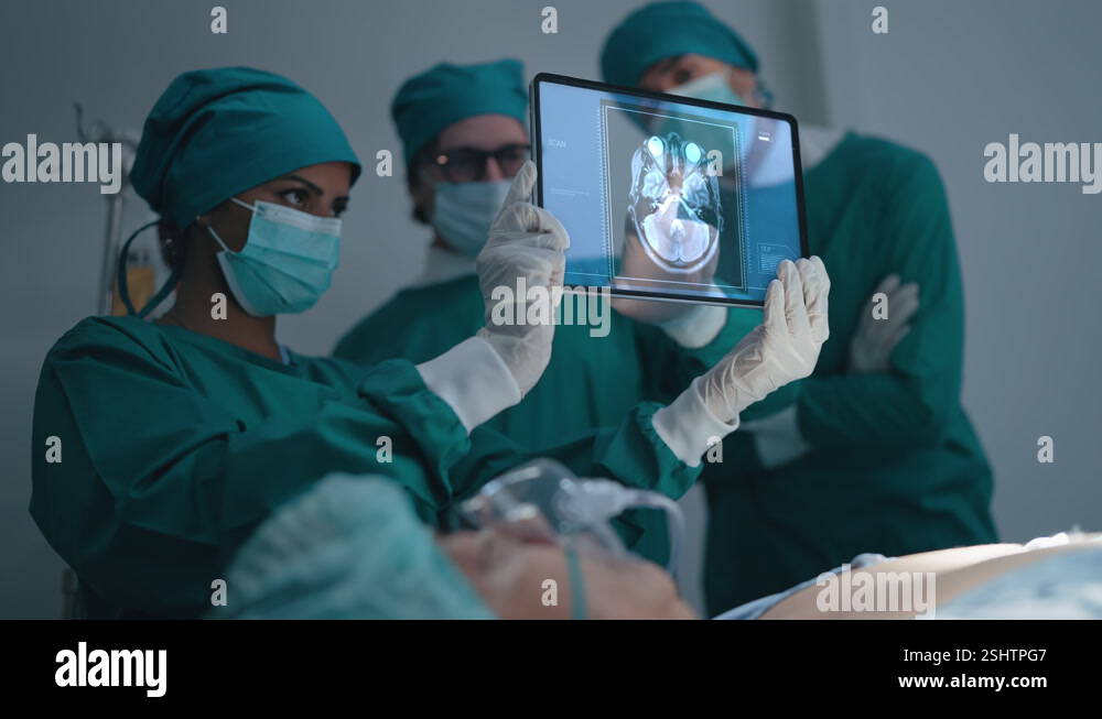 Medical team discuss x-ray of patient with MRI brain scan, imaging of the brain Stock Video ...