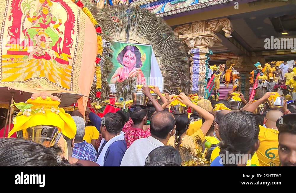 Hindu devotees with traditional appearance outside Murugan temple ...