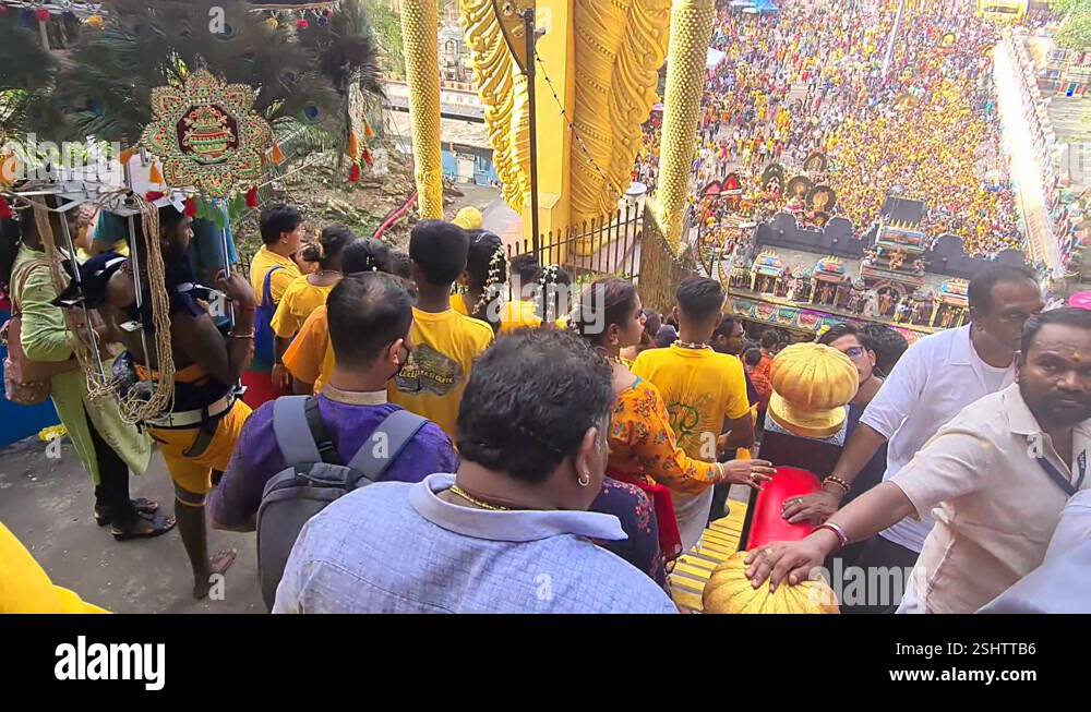 Hindu devotees with traditional Kavadi on stairs of Murugan temple on ...