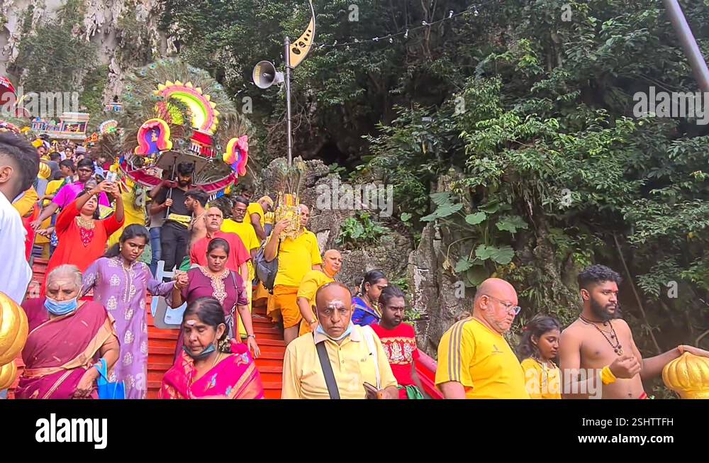 Tamil Hindus with Kavadi walking on stairs of Murugan temple on ...