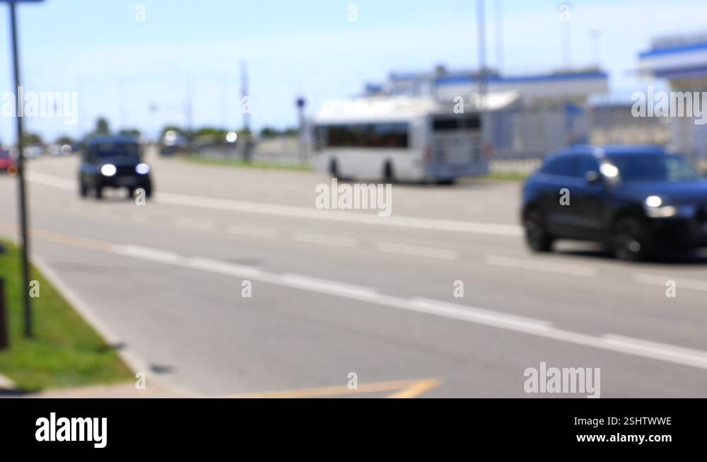 Flow cars with headlights quickly moves along asphalt road, bus goes towards it Stock Video ...