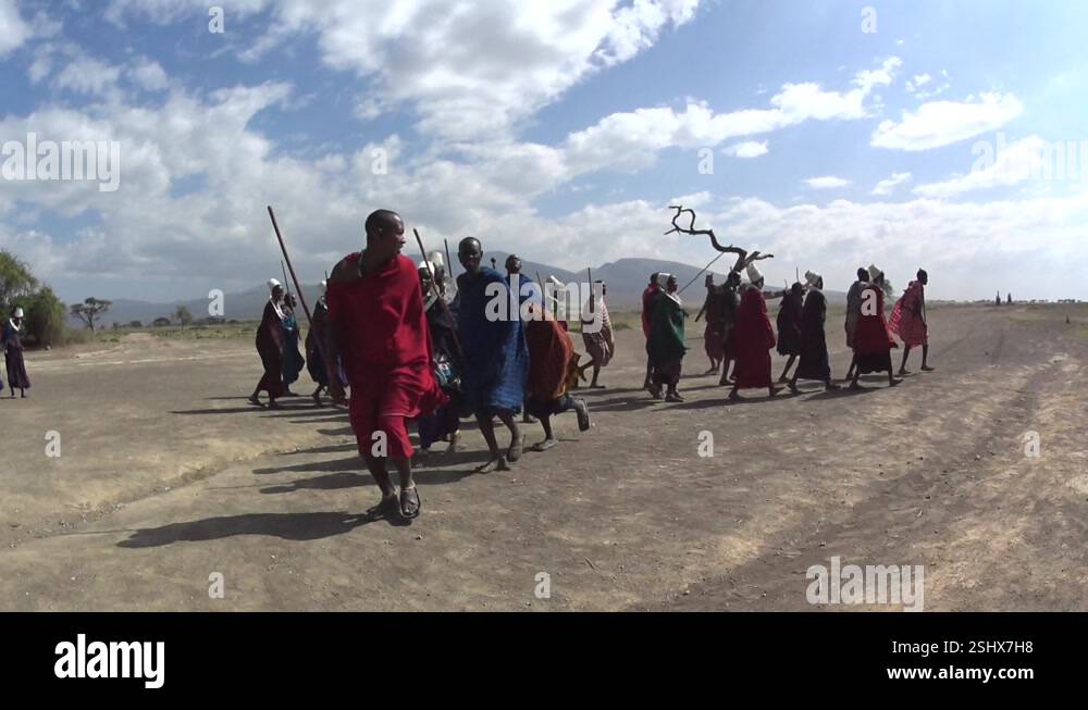 African Maasai tribe in traditional folk costumes performing a ritual ...