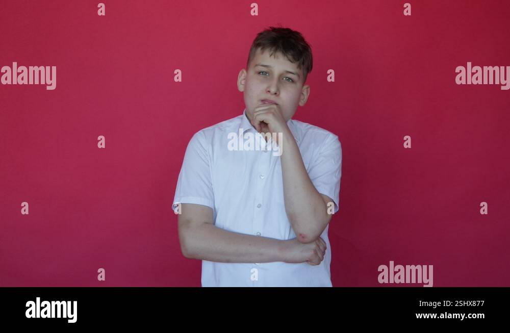 Facial expressions and emotions. Gute teenage boy shows strong ...