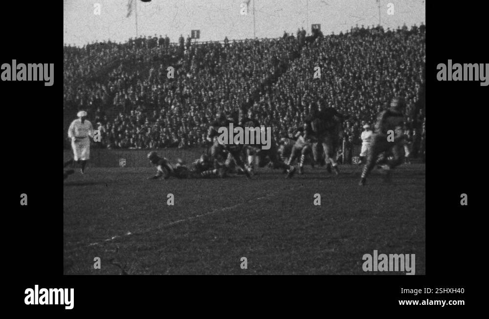1930s: Football game: One team rolls outside for a short gain; other ...