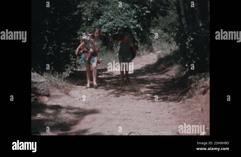 1940s: Girls looking at the cabin. Girls walking down the path with ...