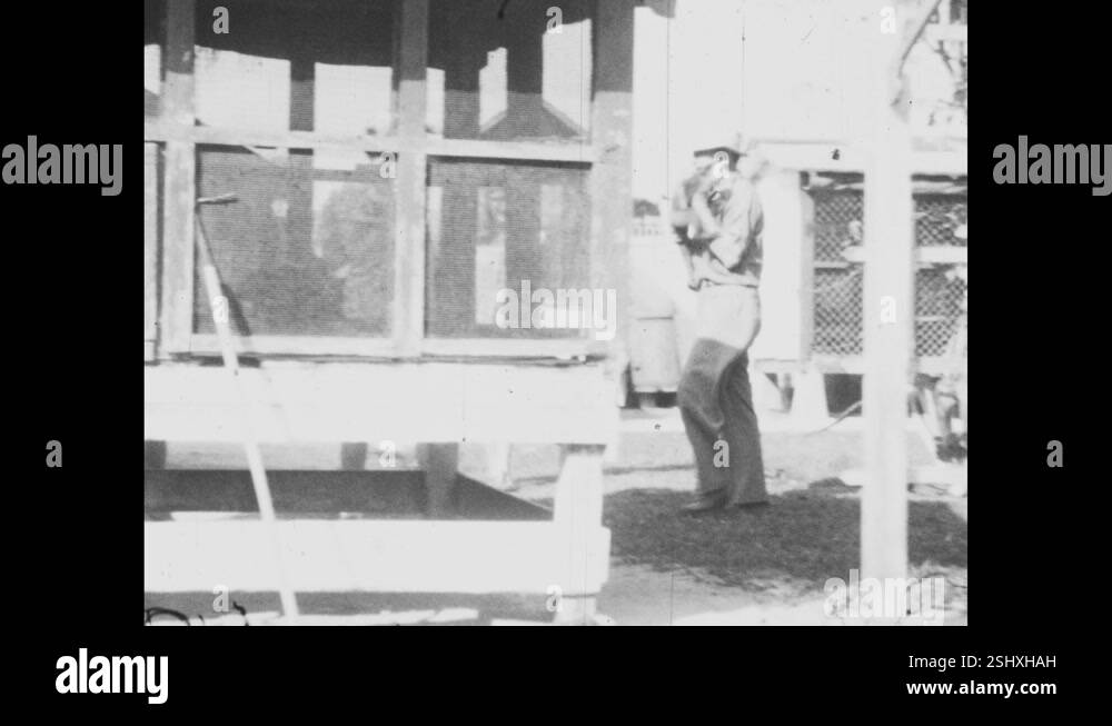 1940s: Bald eagle in a cage. Zookeeper catching a monkey. Girls and ...