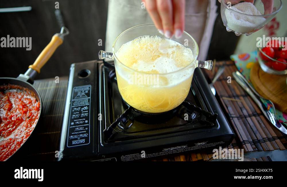 Chef Salting Food In Kitchen. Boiling Water In Pot. Chef Adds Salt Dish ...