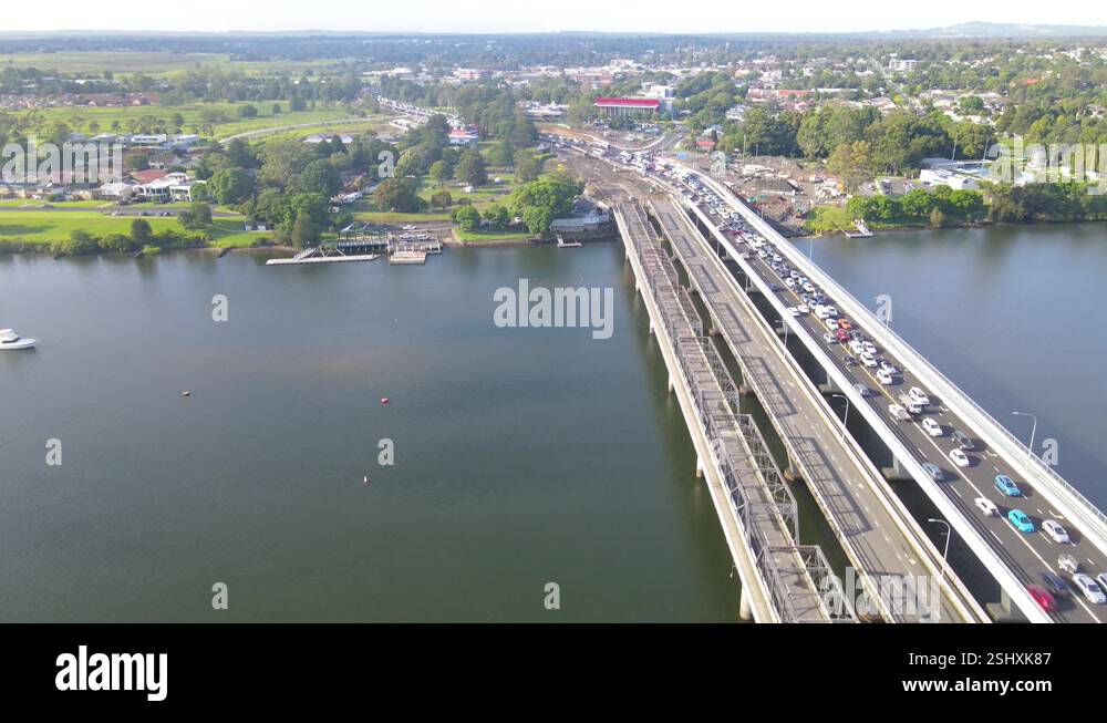 Aerial drone reverse view of Nowra Bridge crossing Shoalhaven River ...