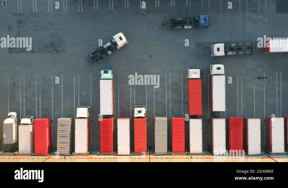 Aerial top down view of warehouse with a lot of semi-trucks and cargo ...