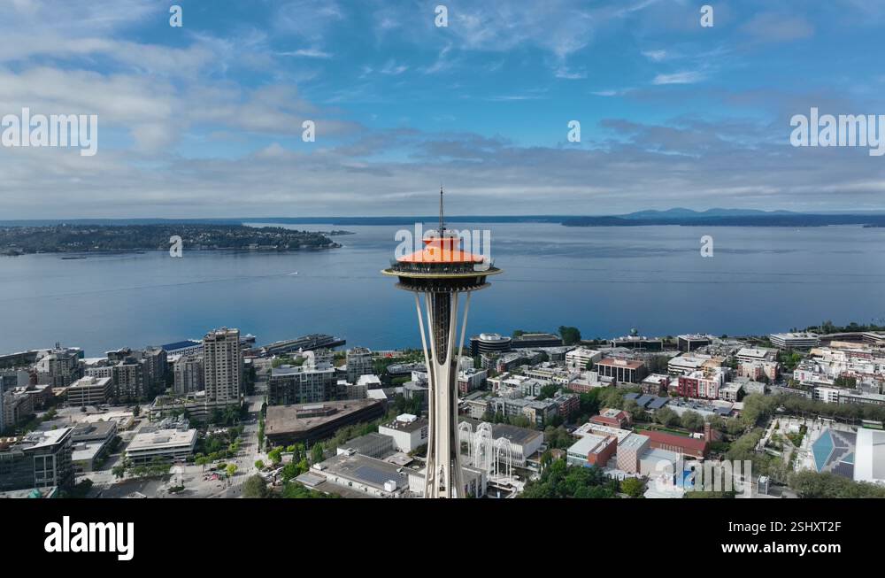 Wide aerial view of the Seattle Space Needle with the Puget Sound in ...