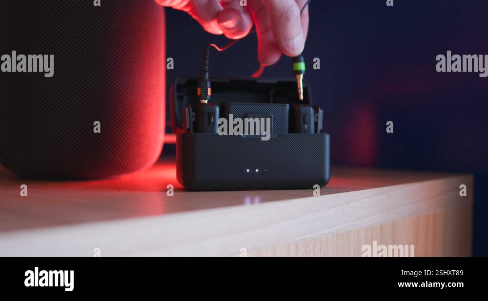 Hand connecting some sound devices. video making equipment. Red ...