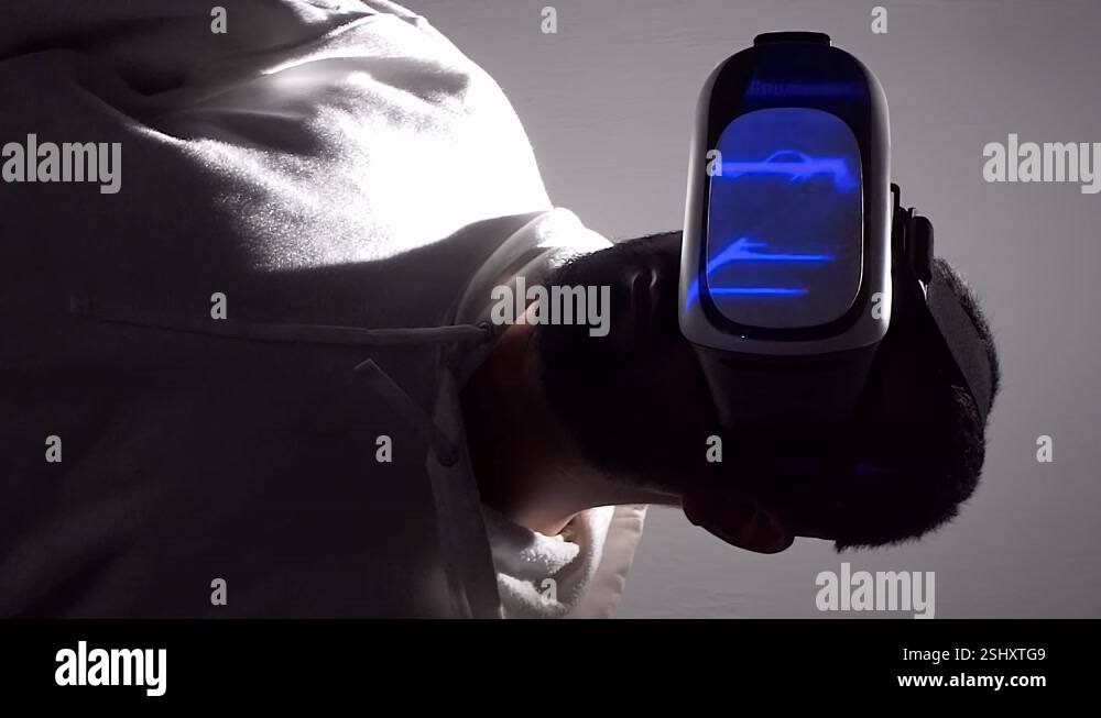 Man looking sideways with head-mounted VR headset, digital overlay ...