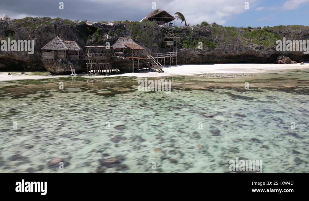 Exotic beach Mtende of tropical island on hi tide time. Ocean breakers ...