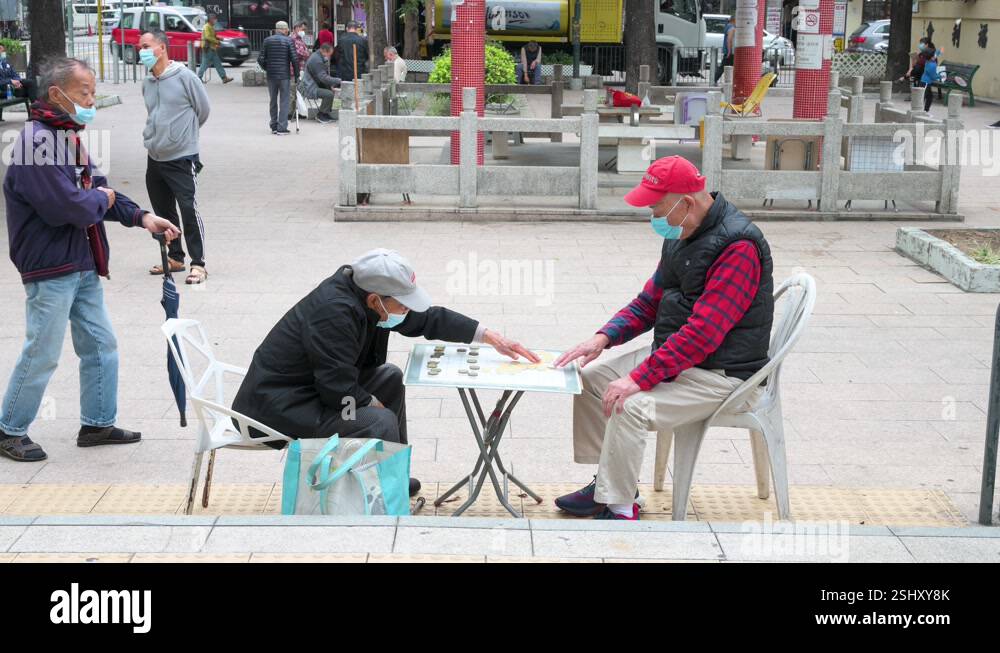 Senior men wearing face masks play chess at a park in Hong Kong Stock ...
