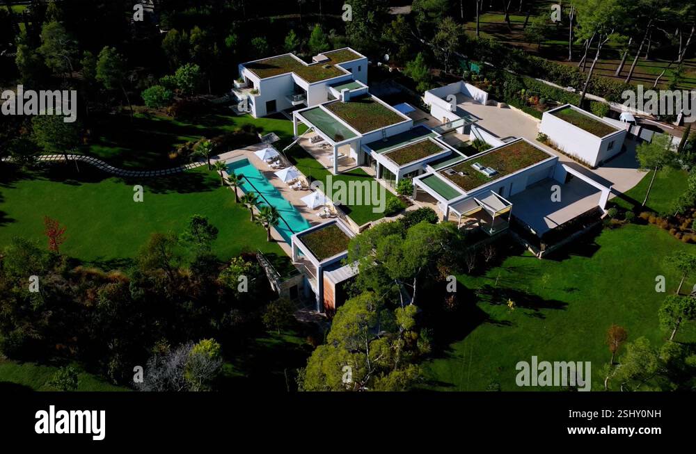Establishing shot of a multi-million euro mansion with private pool in ...