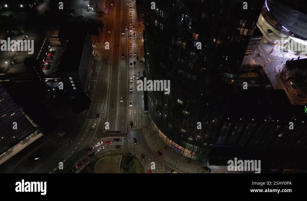 Tilting aerial reveal of the Radisson Blu hotel and Birmingham West ...