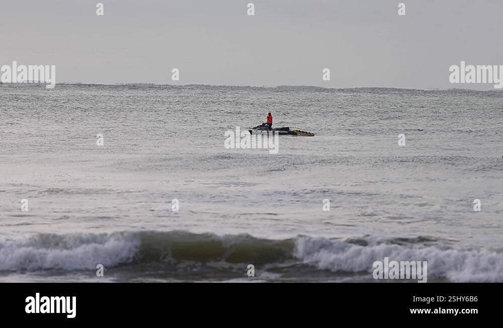 The jet ski (or water bike) dangles on the sea waves in the twilight of ...
