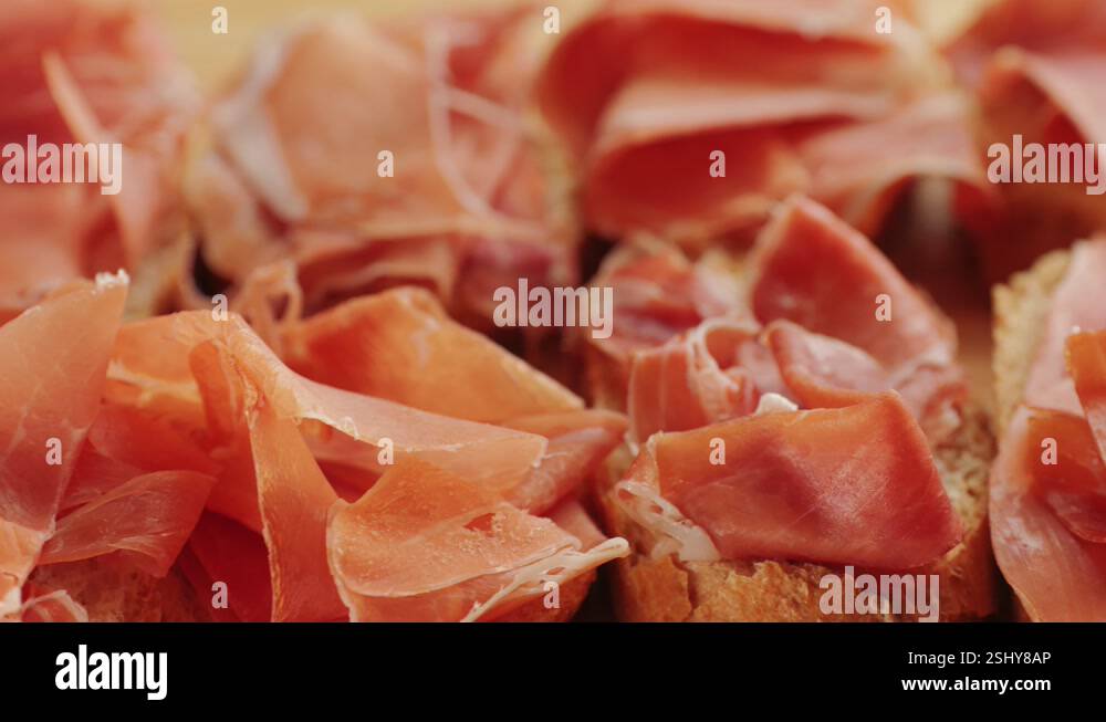 Jamon iberico tapas close up, chef cooking the best spanish ham pork ...