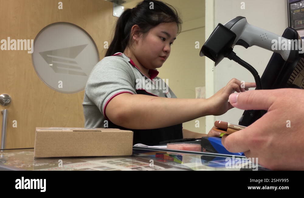 The motion of the worker checking the parcel for the customer inside ...