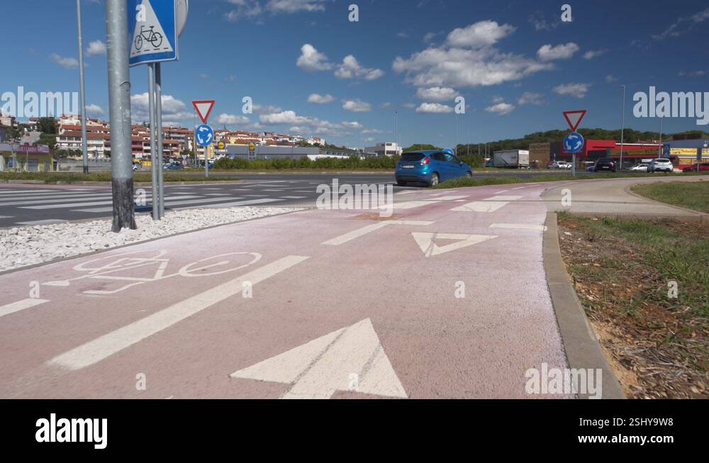 Pedestrian's POV. A walk along the bike path along the city road Stock ...