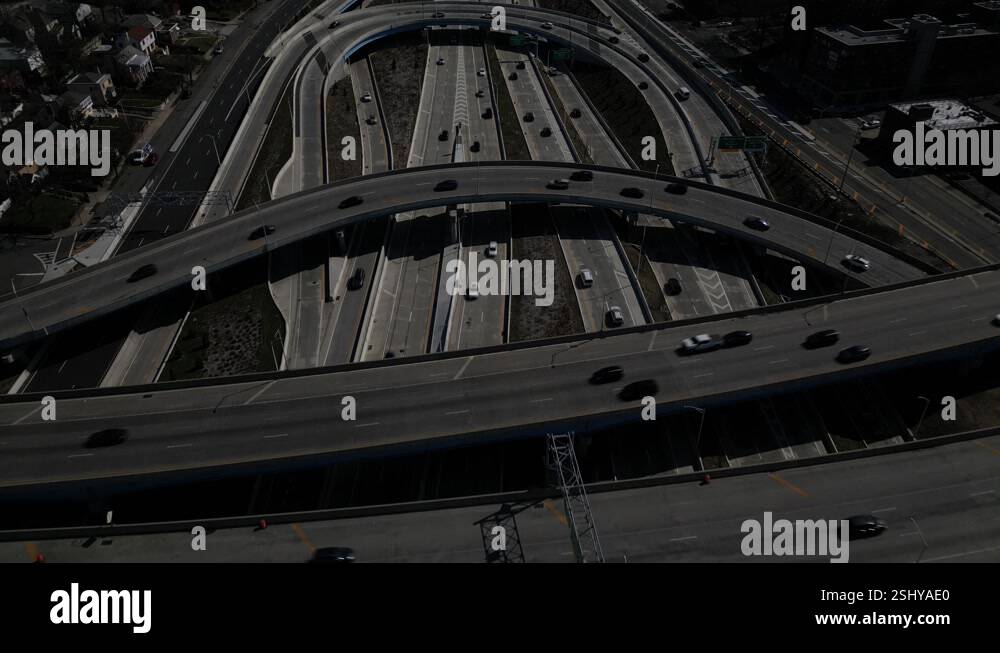 An aerial view high over a highway intersection in Queens, New York on ...