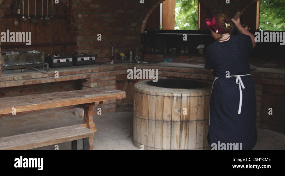 Woman In The Kitchen Cooking Traditional Kakheti Bread (Shotis Puri) In ...