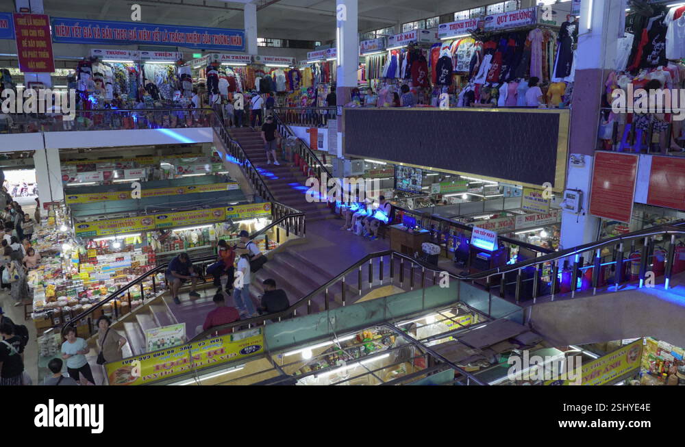 Static wide view of Han Market stairs as market goers walk up and down ...