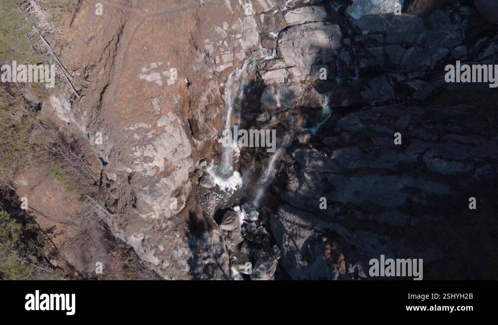 Drone flight over the rocks and a view of one of the highest waterfalls ...