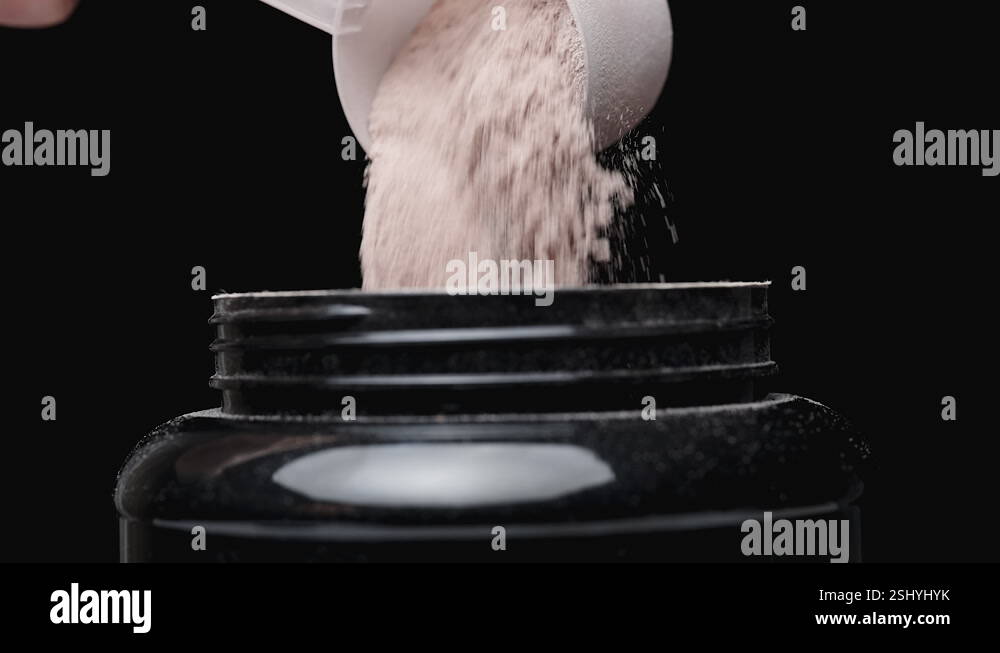 I pour the chocolate protein powder out of a measuring spoon, into a ...