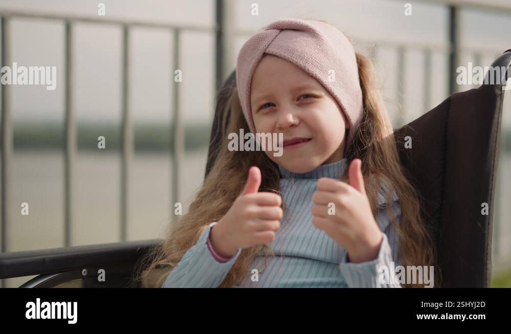 Toothless girl smiles in camera showing thumbs up gesture Stock Video ...