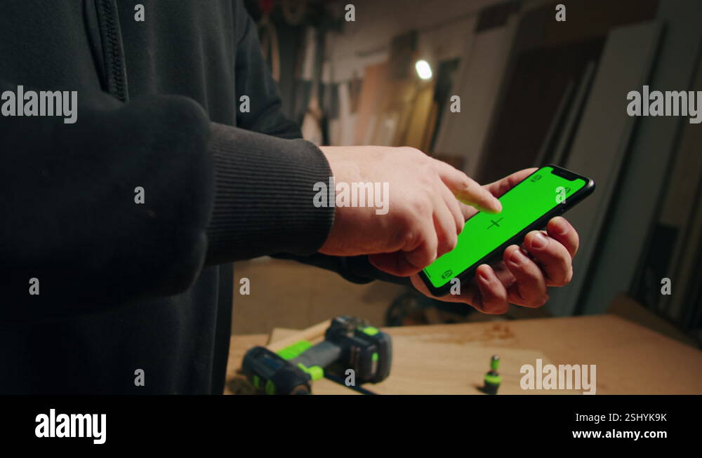 Portrait of Carpenter man choosing on phone with aroma key color ...