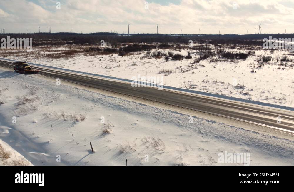Truck with snowplough clearing freeway from snow in America Stock Video ...