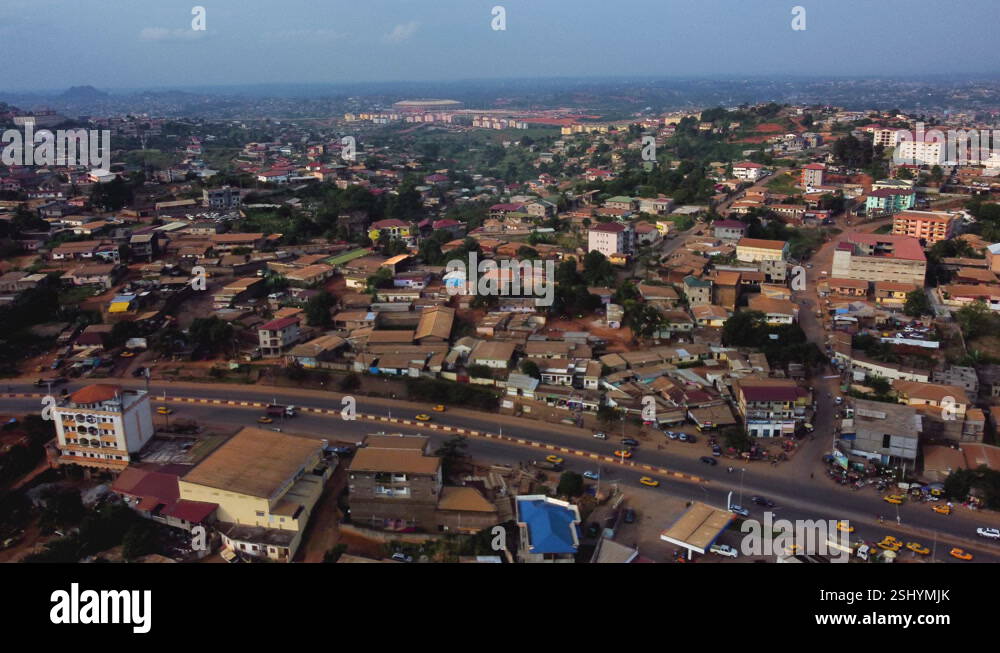 Aerial view of traffic and African homes in the Emana district of ...