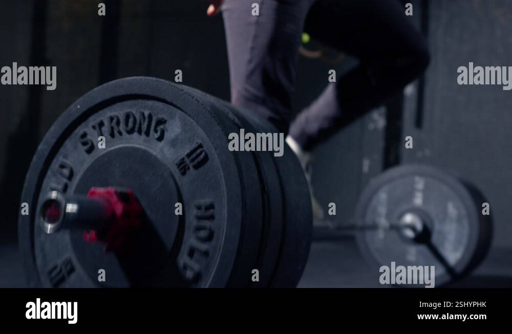 Man dropping the bar with high weight to the floor after doing deadlift ...