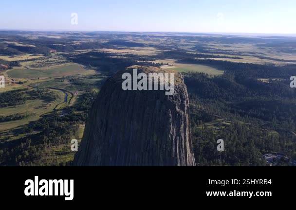 A breathtaking drone view of Devils Tower, Wyomings iconic volcanic ...