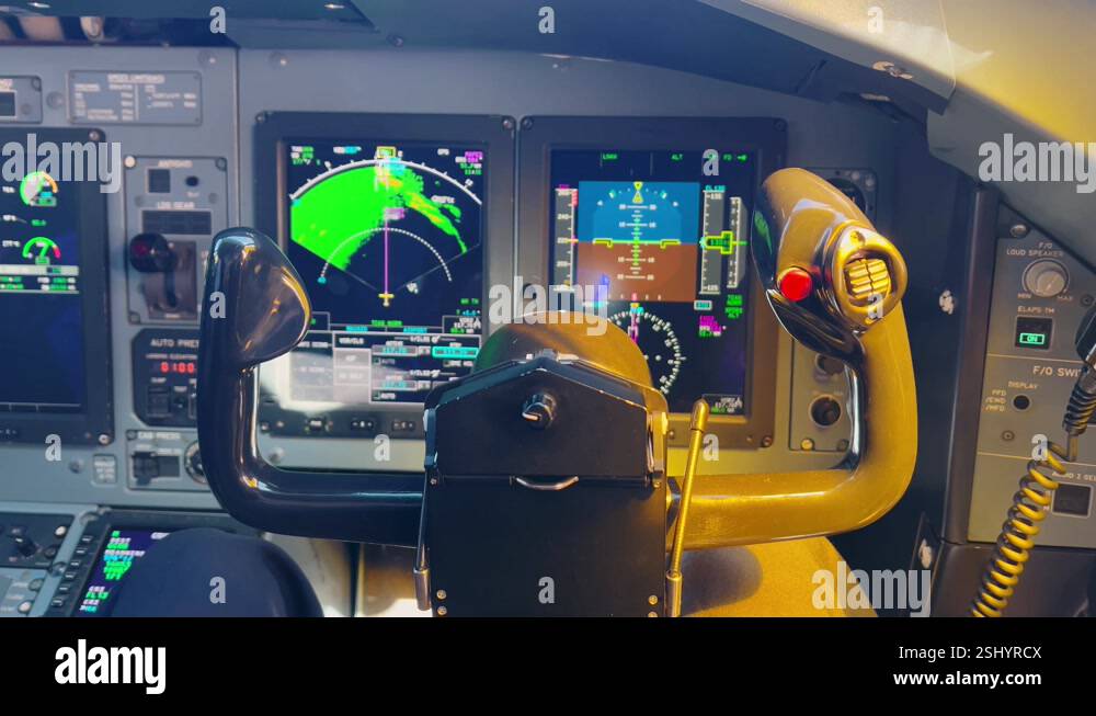 First person view of a pilot in the cockpit of an airplane in flight ...
