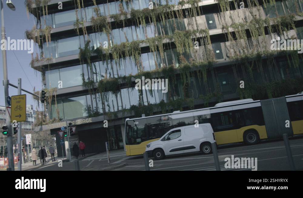 Bus and Cars Parked Near Building Covered In Plants - Schlossplatz In ...