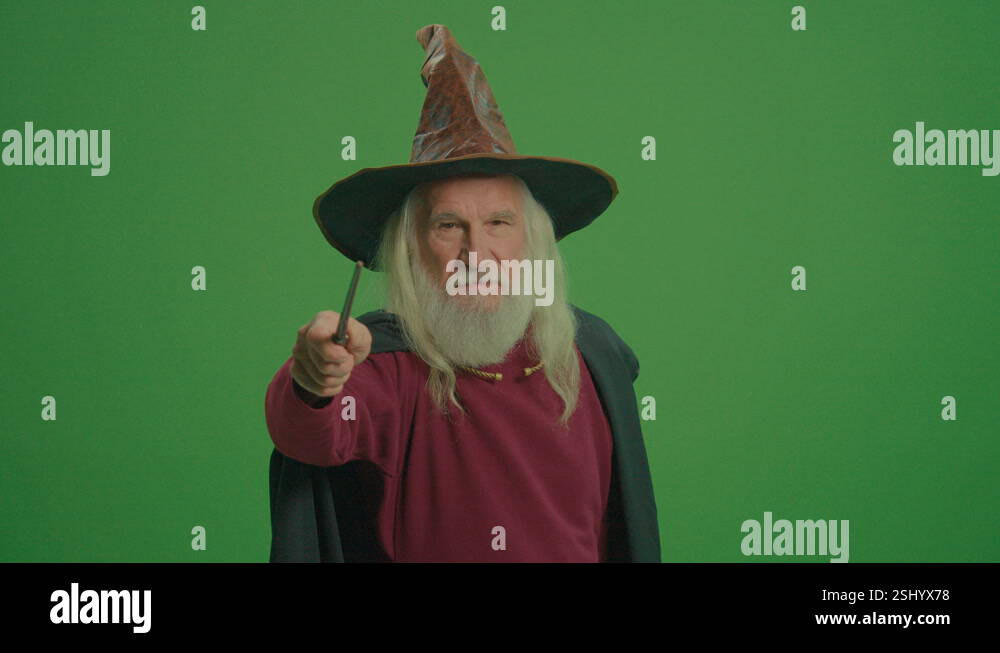 Green Screen. Portrait of an Old Wizard Makes Wishes With a Magic Wand ...