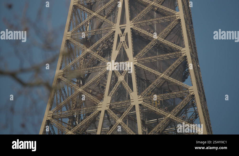 Elevator goes up to the top of the famous Eiffel tower, slow motion ...