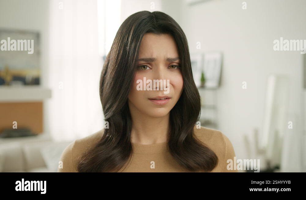 Closeup upset girl looking at camera. Portrait of sad woman face. model ...